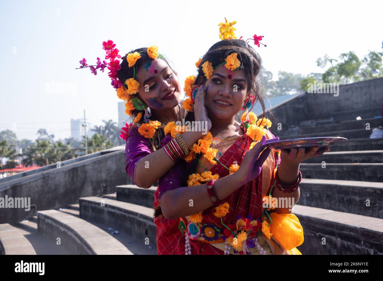 Women wear traditional dresses with floral ornaments and perform during ...