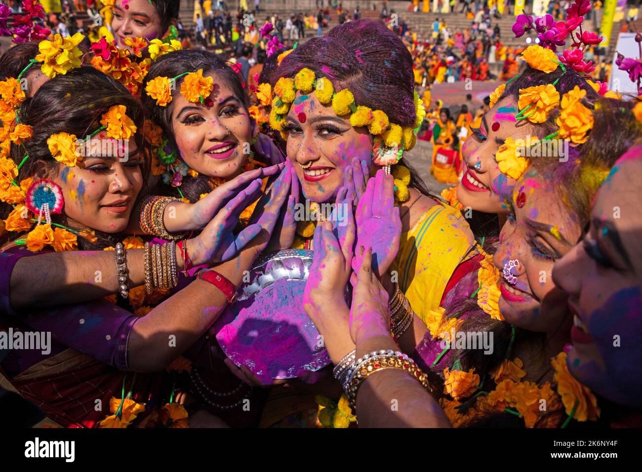 Women wear traditional dresses with floral ornaments and perform during ...