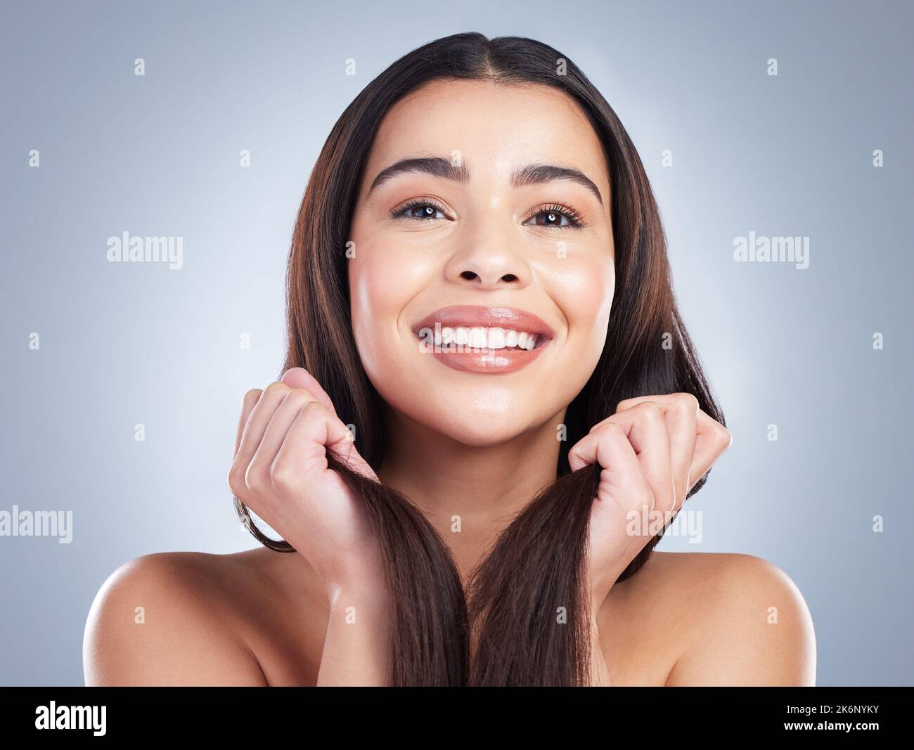 Portrait of a beautiful mixed race woman with clean skin and shiny ...