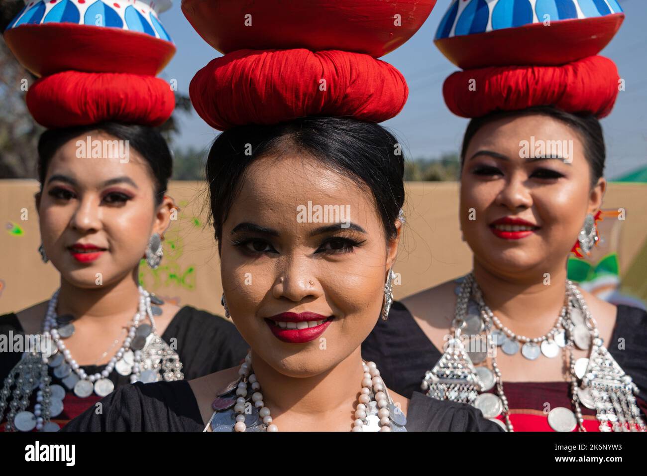 Women wear traditional dresses with floral ornaments and perform during ...