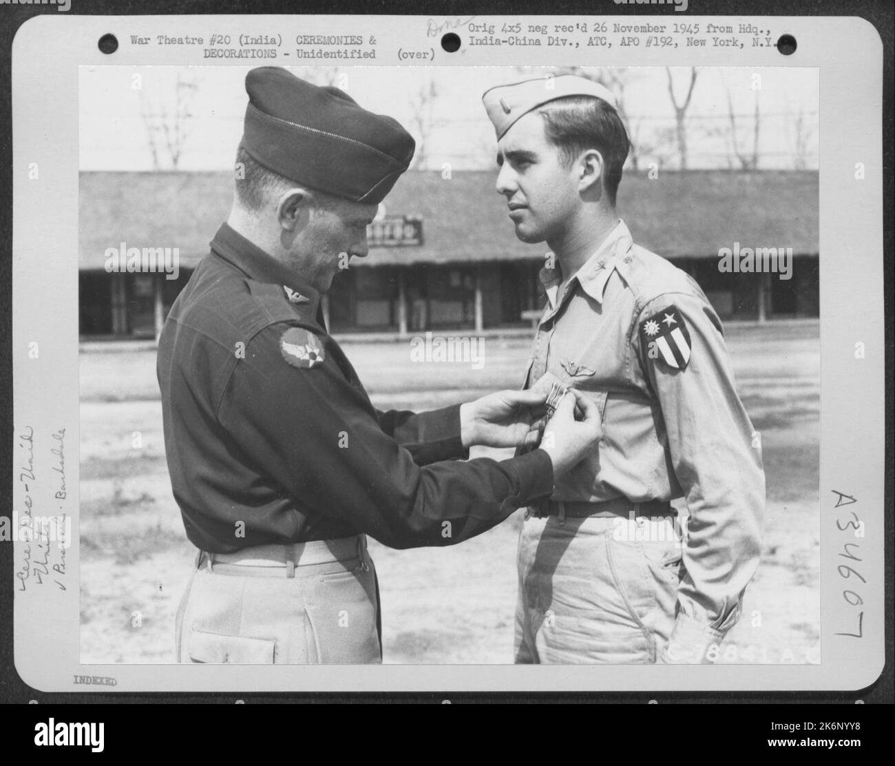An Officer Presents The Distinguished Flying Cross To A Member Of The ...