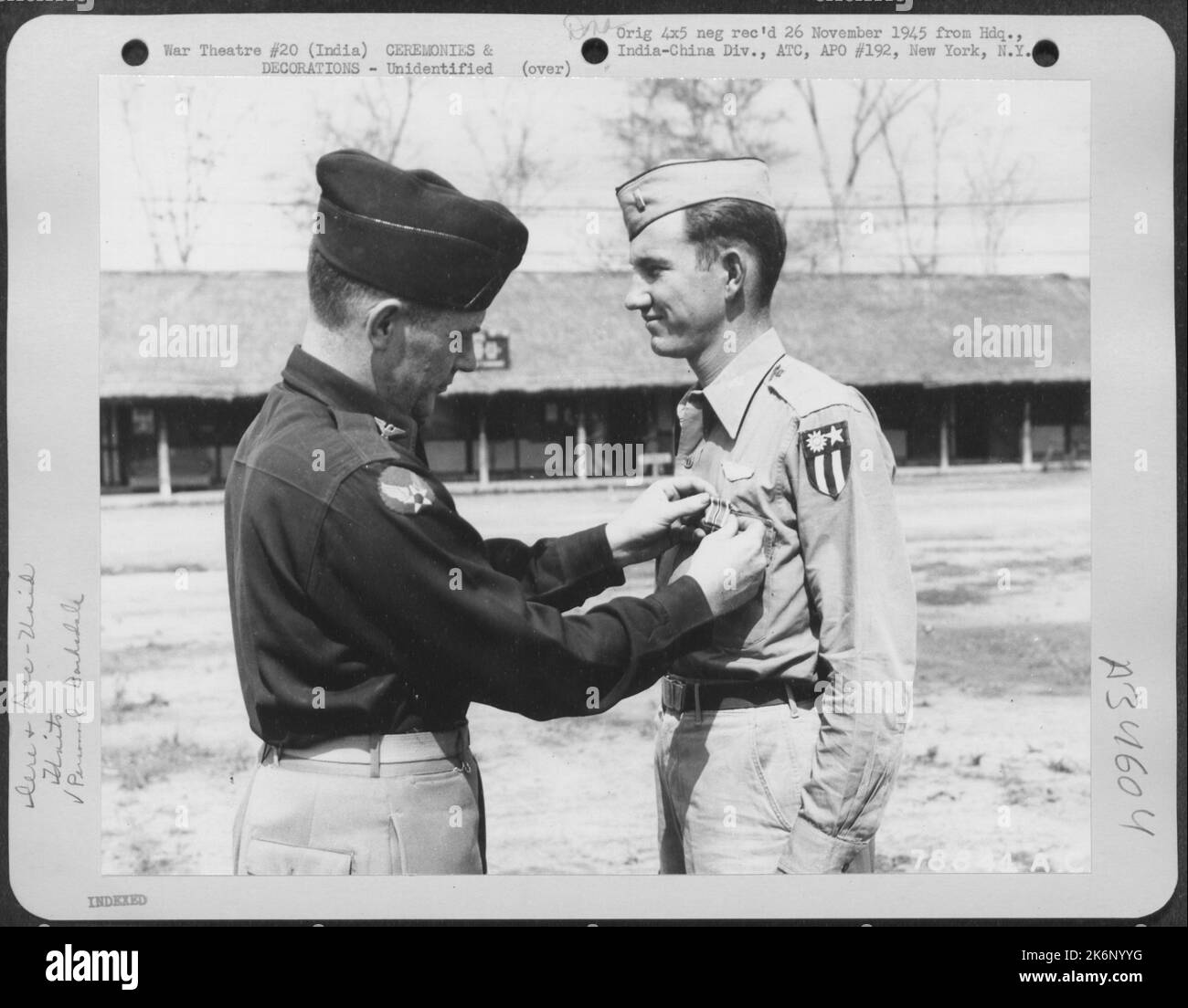 An Officer Presents The Distinguished Flying Cross To A Member Of The ...