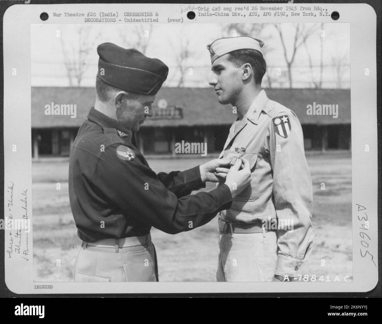 An Officer Presents The Distinguished Flying Cross To A Member Of The ...