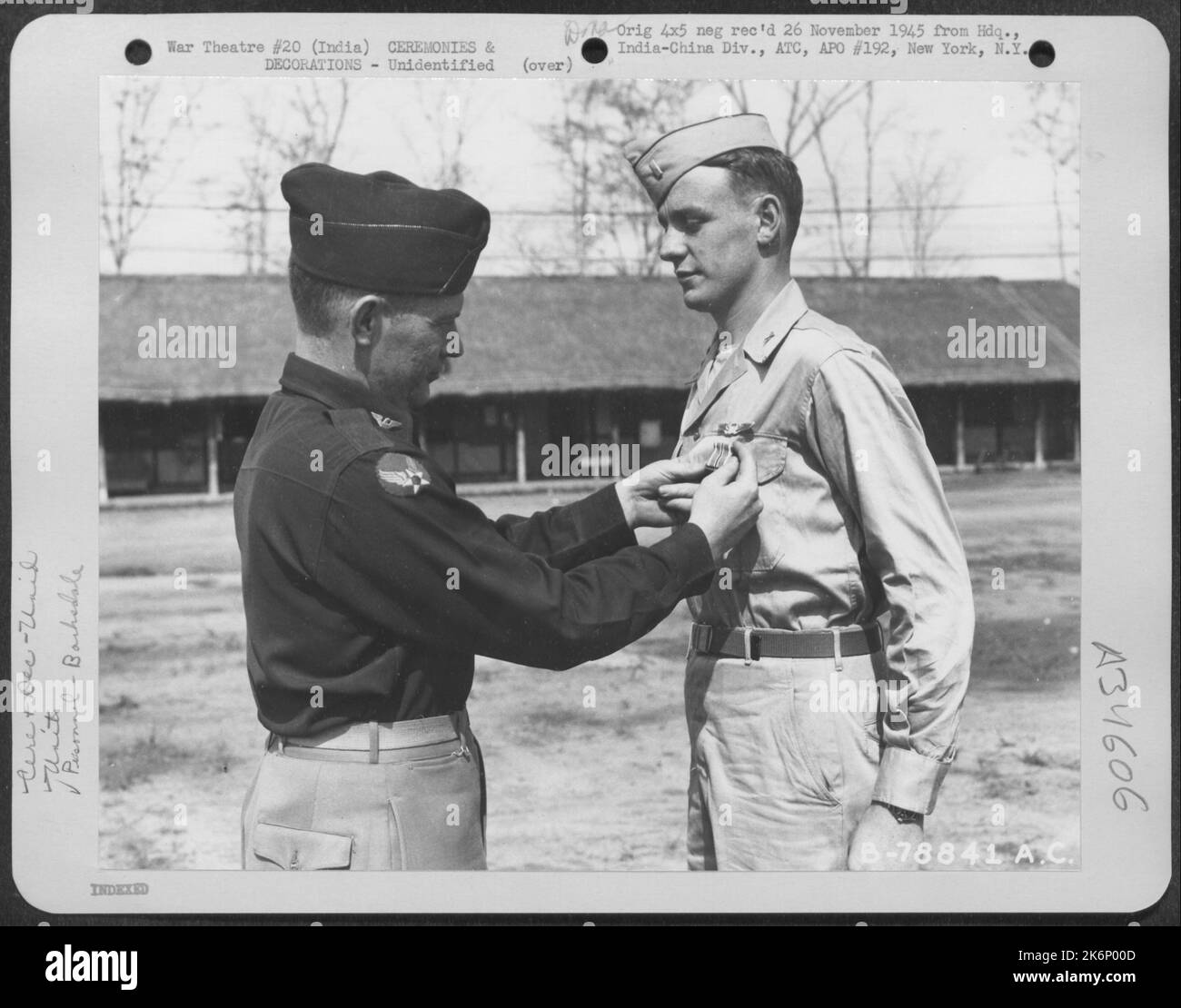 An Officer Presents The Distinguished Flying Cross To A Member Of The ...
