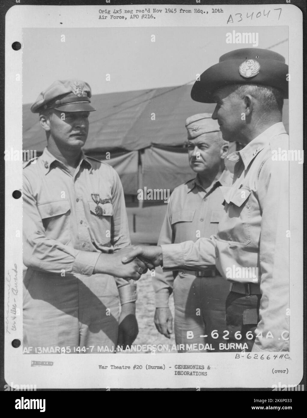 Major General Howard C. Davidson congratulates Major N. Anderson after ...