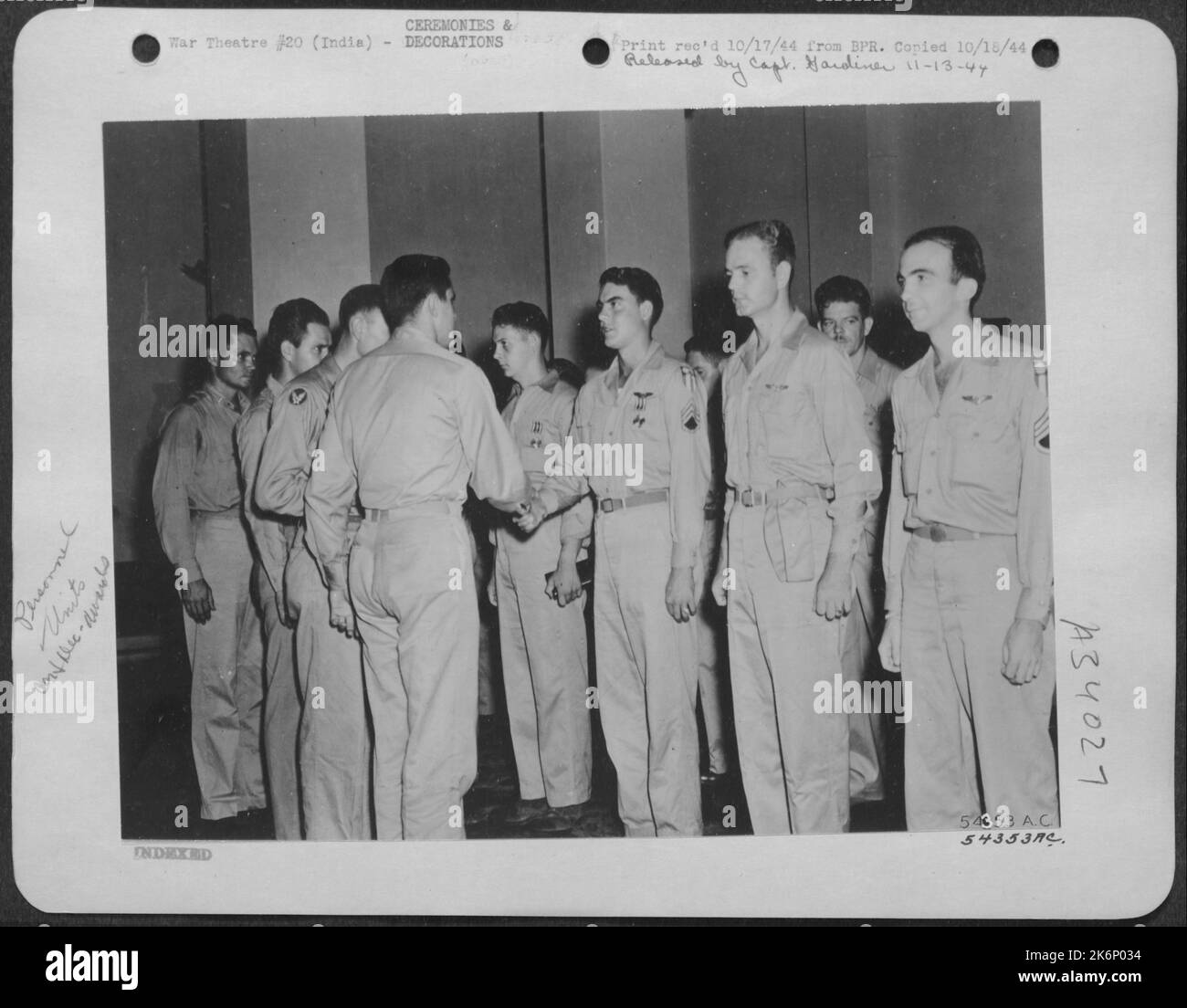 Lt. Col. Boebel of the First Air Commando Group distributing ...