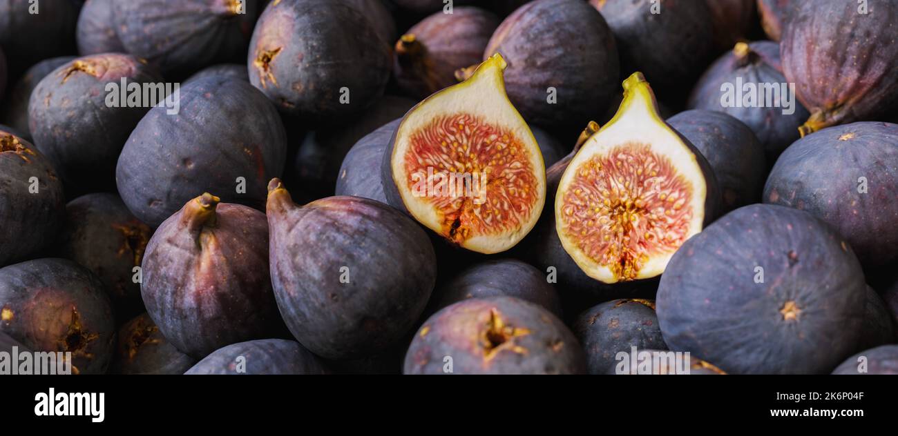 Fresh ripe figs with halved fig as background, Tropical fruit Stock ...