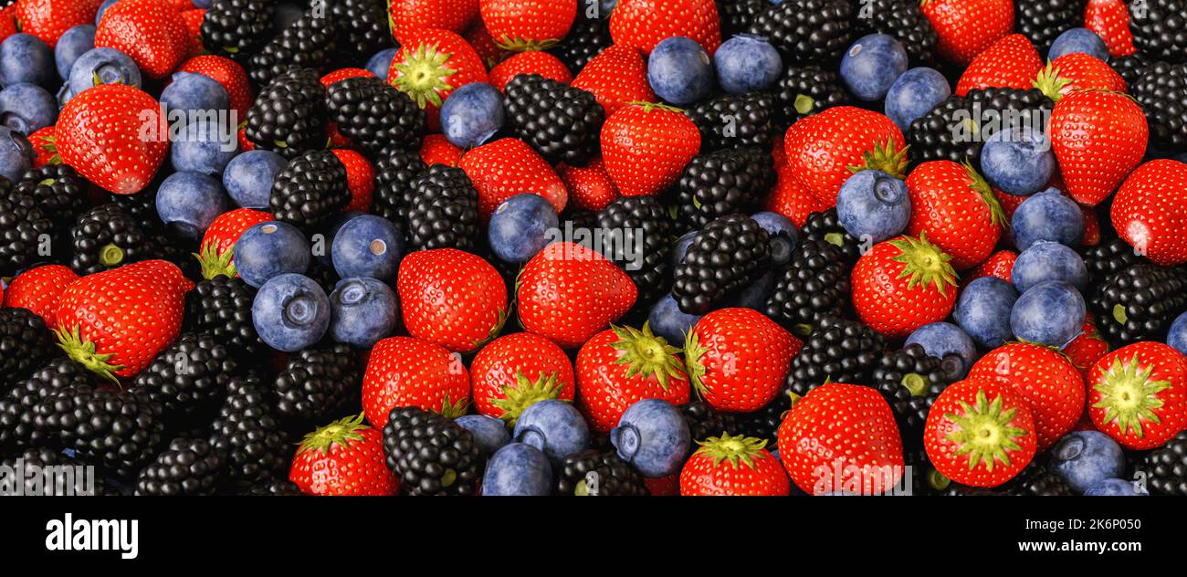 a variation of berry fruits at fruit market Stock Photo - Alamy