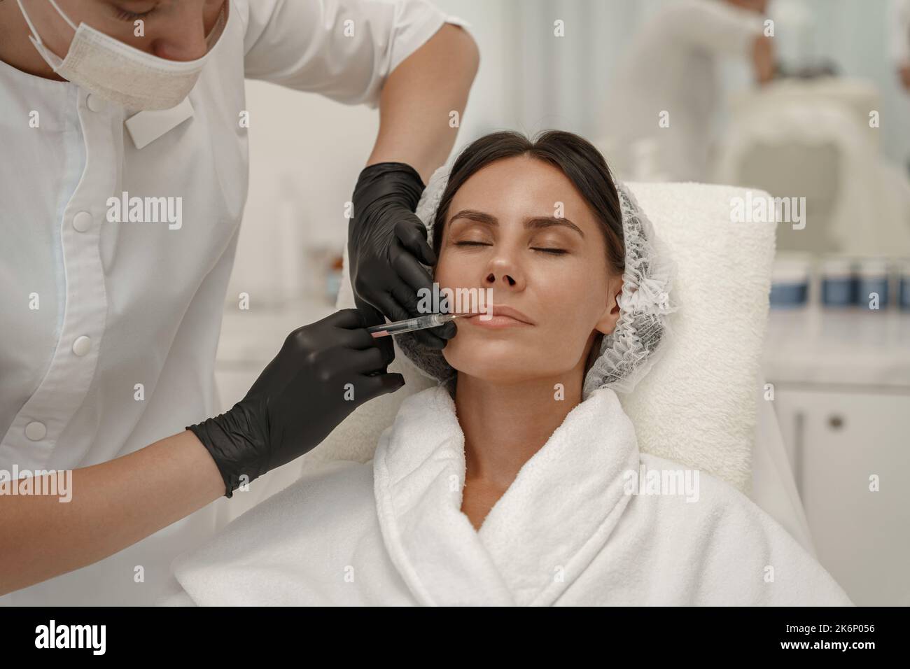 Cosmetologist Makes Rejuvenating Anti Wrinkle Injections On Face Of
