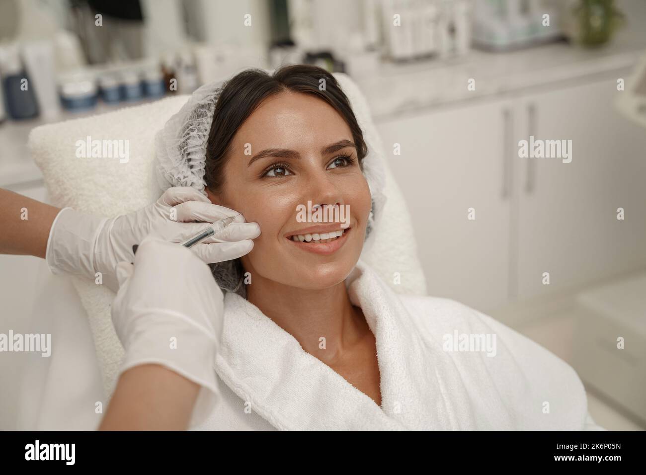 Cosmetologist Makes Rejuvenating Anti Wrinkle Injections On Face Of