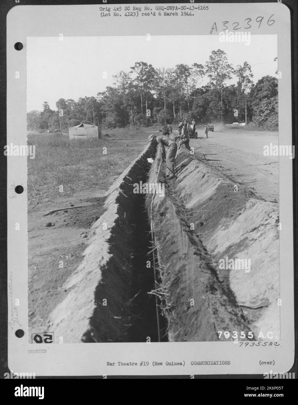 Men of the 440th Signal Construction Co., attached to an Air Force unit ...