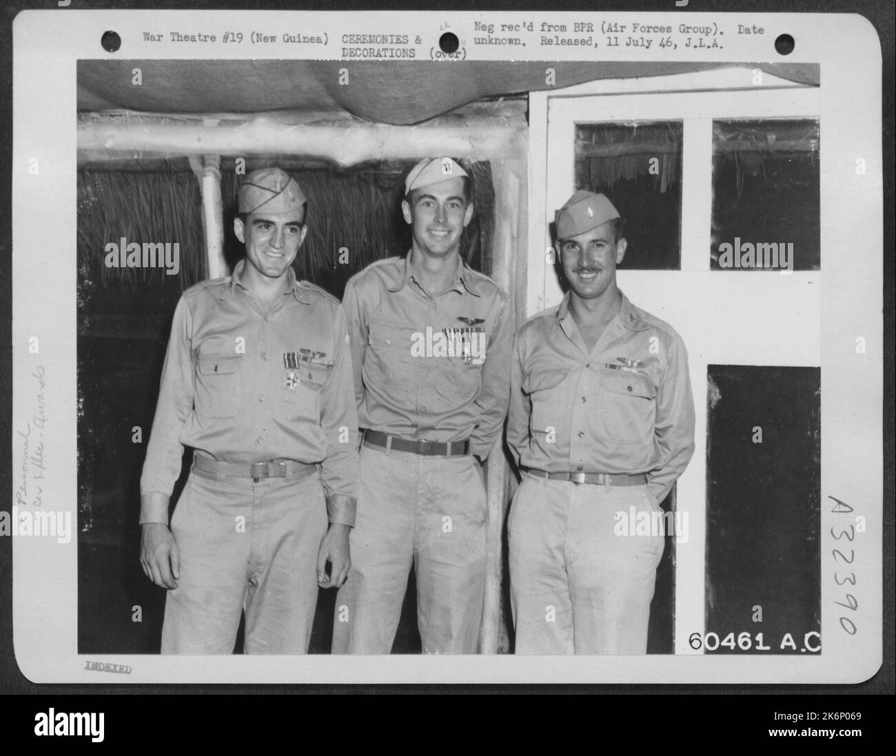 Presentation ceremonies were held at night in New Guinea for, left to ...