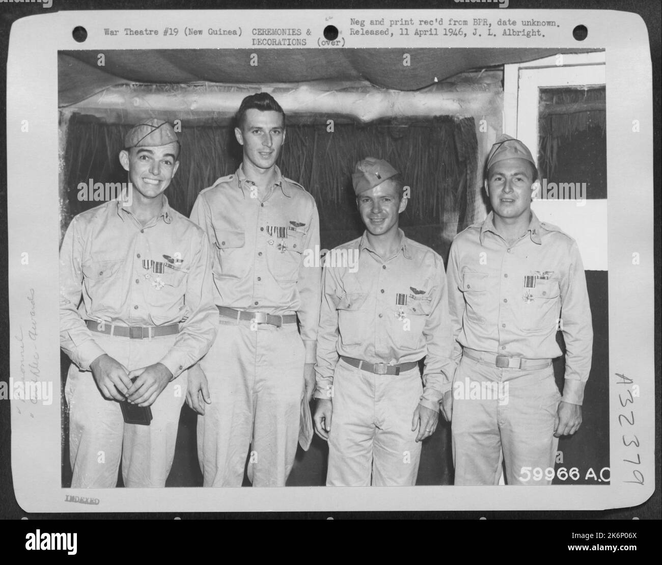 These fighter pilots were decorated at ceremonies in New Guinea. Left ...