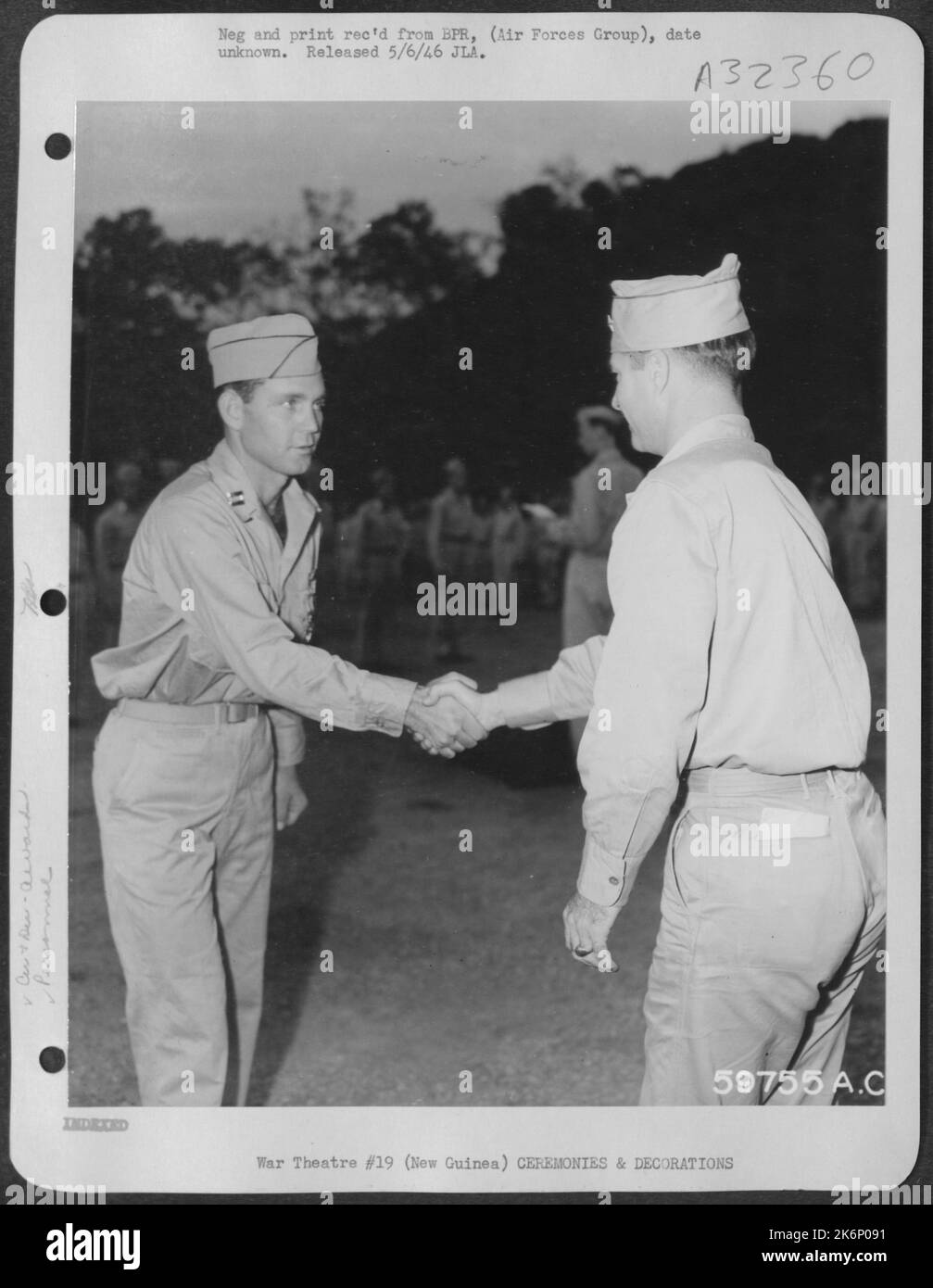 Capt. Carl E. Taylor (left) of Denison, Texas being presented with the ...