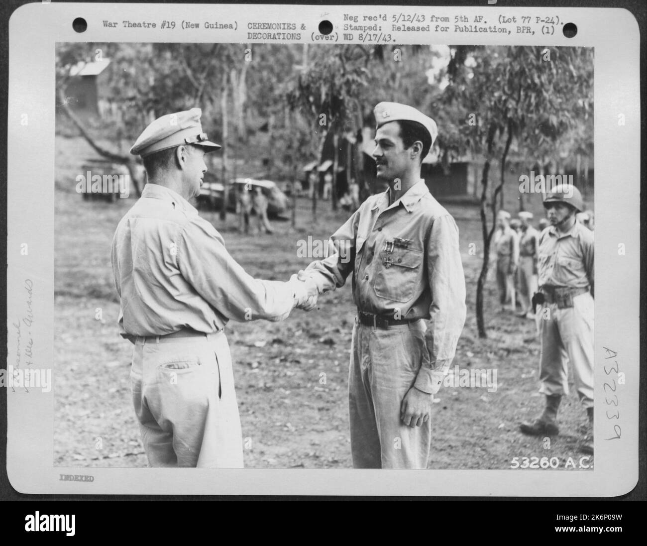 Lt. General George C. Kenney (left) congratulates Capt. Richard Taylor ...