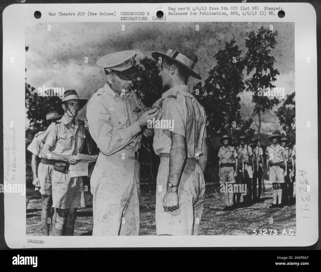 General Ennis C. Whitehead decorating Pilot Officer John S. Archer with ...