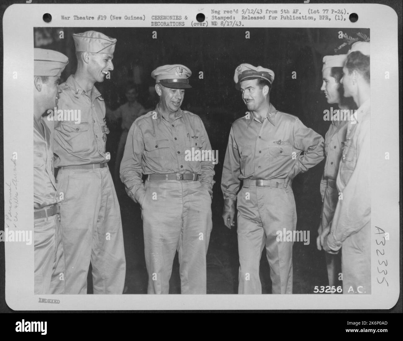 Lt. General George C. Kenney (left, center) and Brig. General Paul B ...