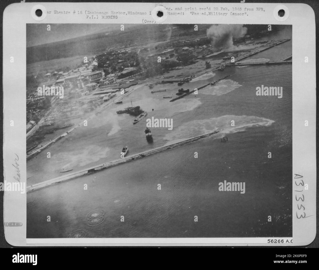 Fifth Air Force "Sun Setters" loose bombs over Zamboange Harbor ...