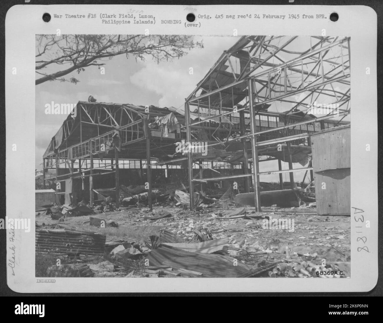 Jap "Betty" planes inside a hangar on clark field were bombed and ...