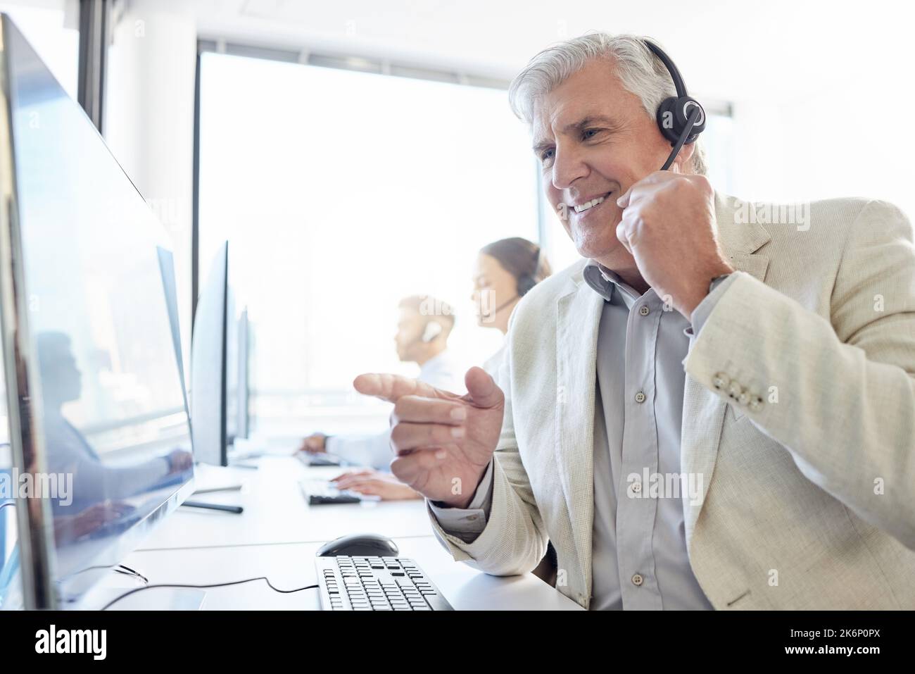 Dont forget to rate my service. a mature man wearing a headset while ...