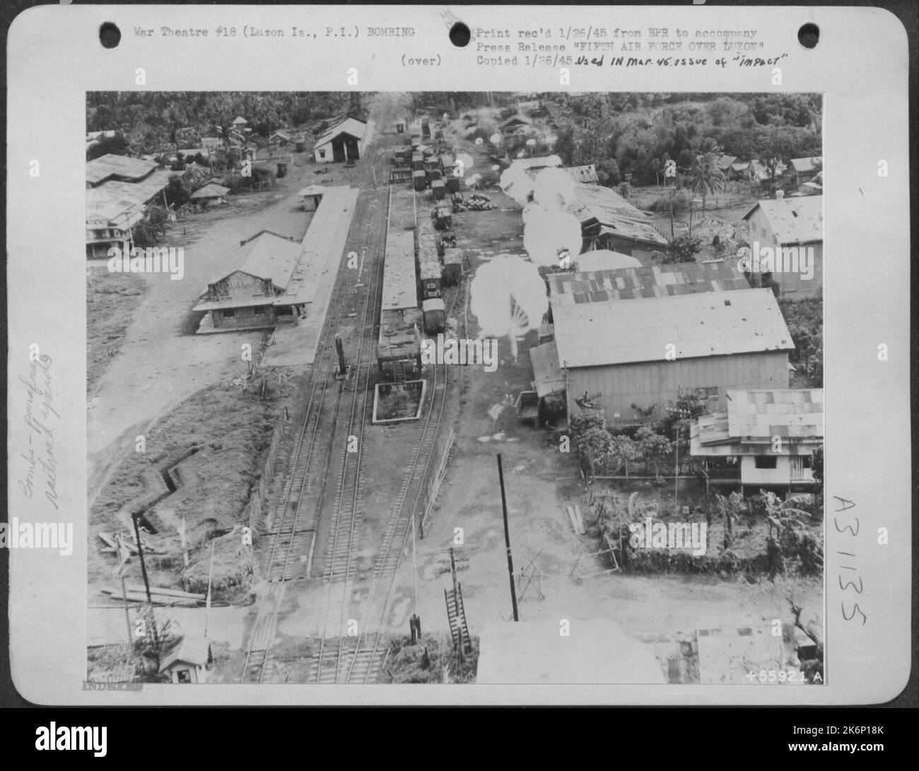 Photo shows parachute bombs, used in low level bombing, falling on Jap ...
