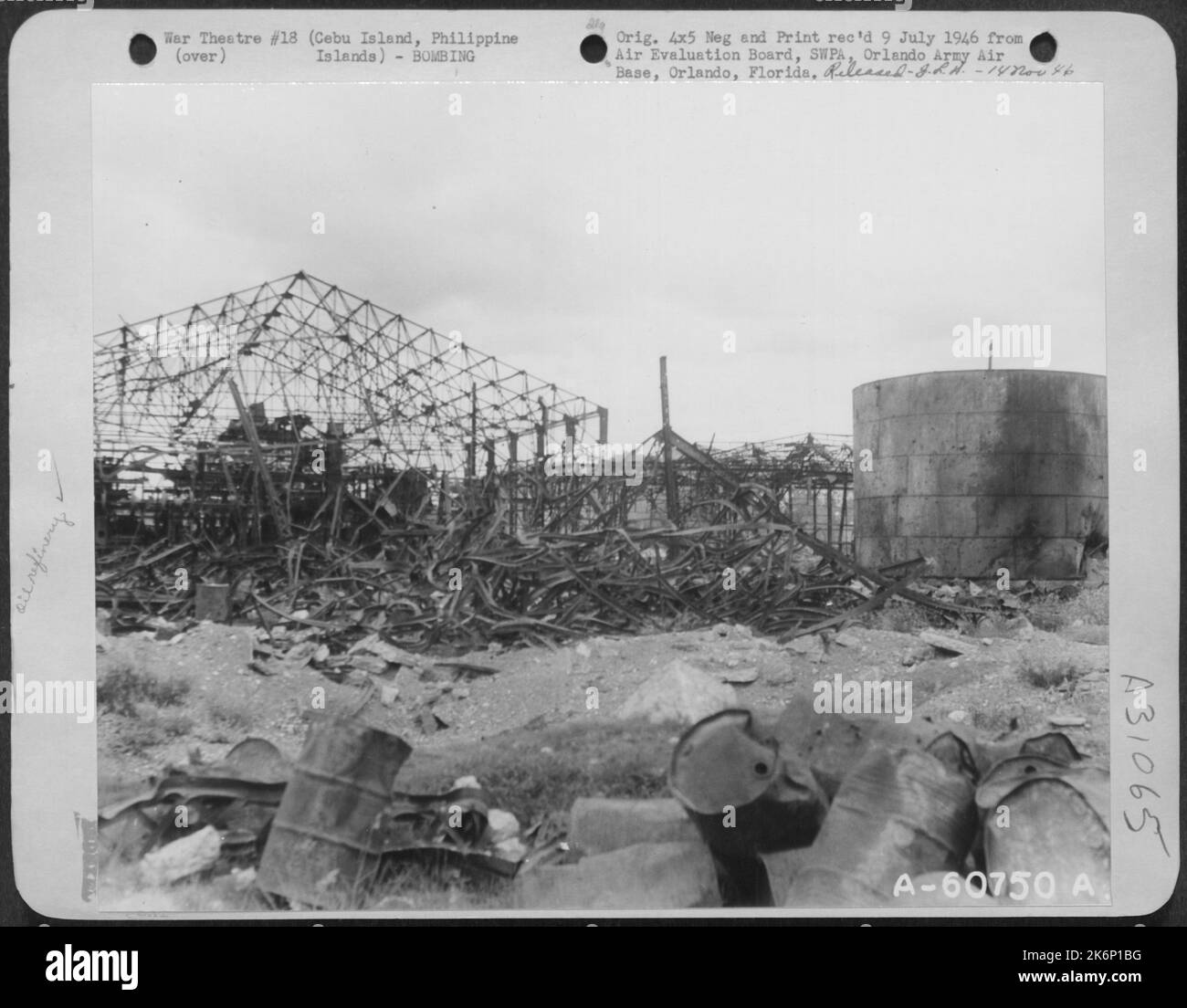 Intense heat left this heap of twisted steel at the Madrigal Oil ...