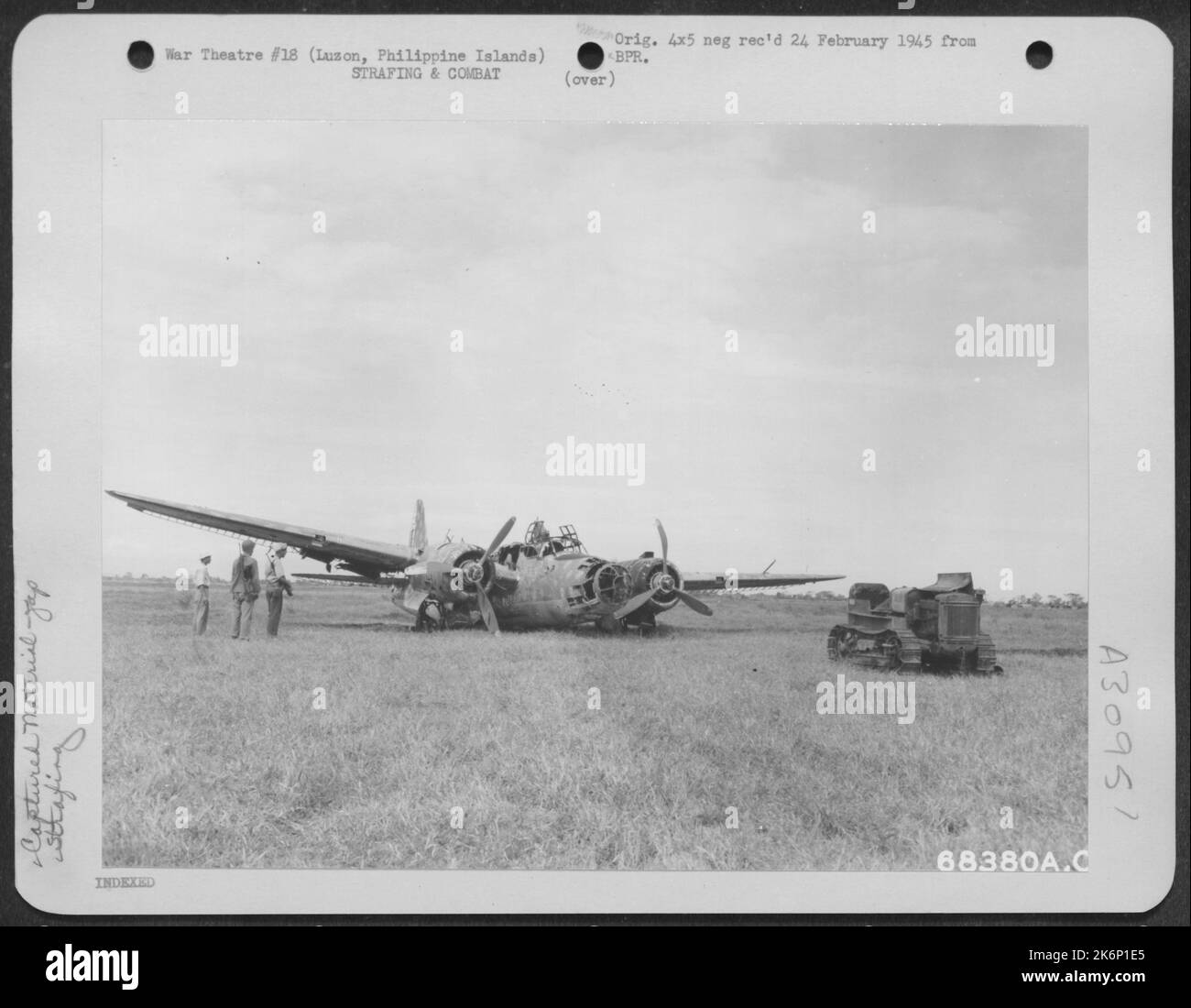 A strafed and burned Jap "Sally" is shown where it was hit on the San ...