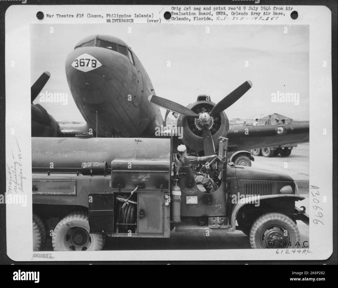 Maintenance crew filling the gas tank of a Douglas C-47 "Skytrain ...
