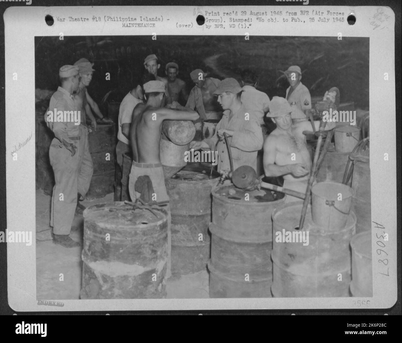 13th AAF men in the Philippine Islands adding Gel to gasoline for use ...