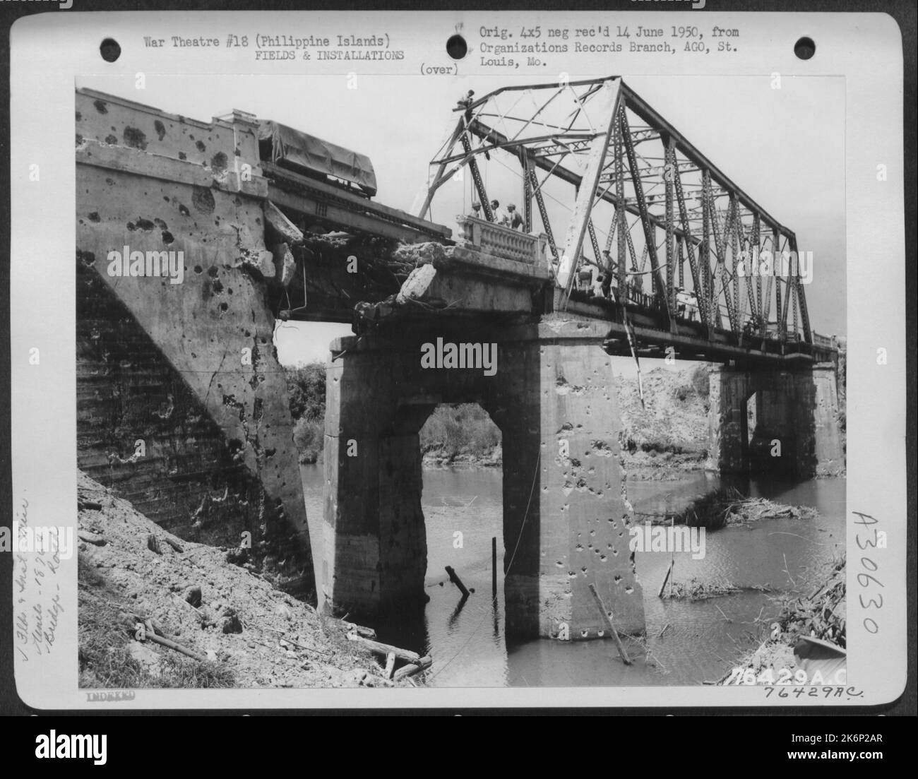 "C" Co., 1876th Eng. Aviation Battalion repair a bomb damaged bridge ...