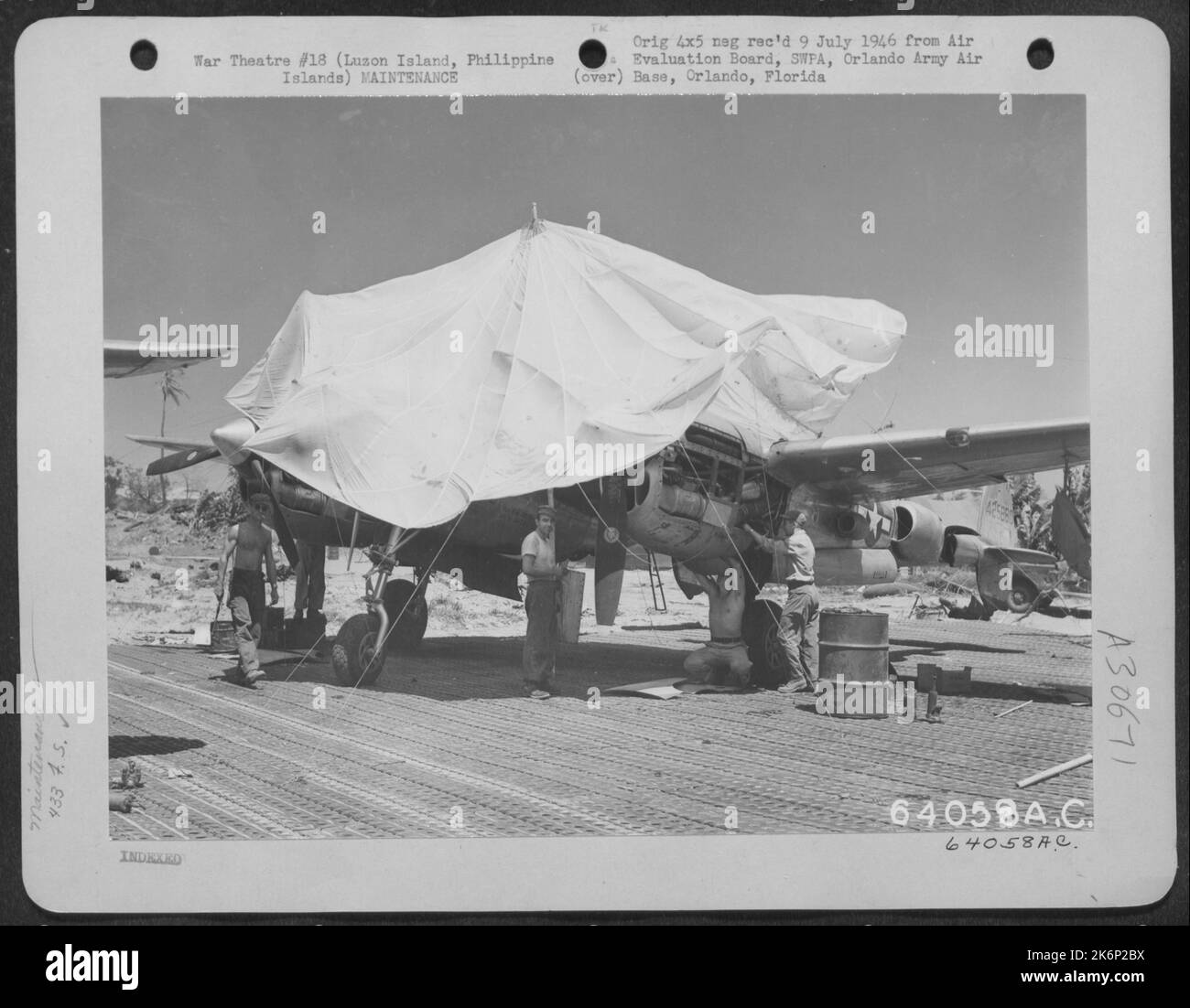 The 433rd Fighter Squadron using a parachute for shade on the airstrip ...