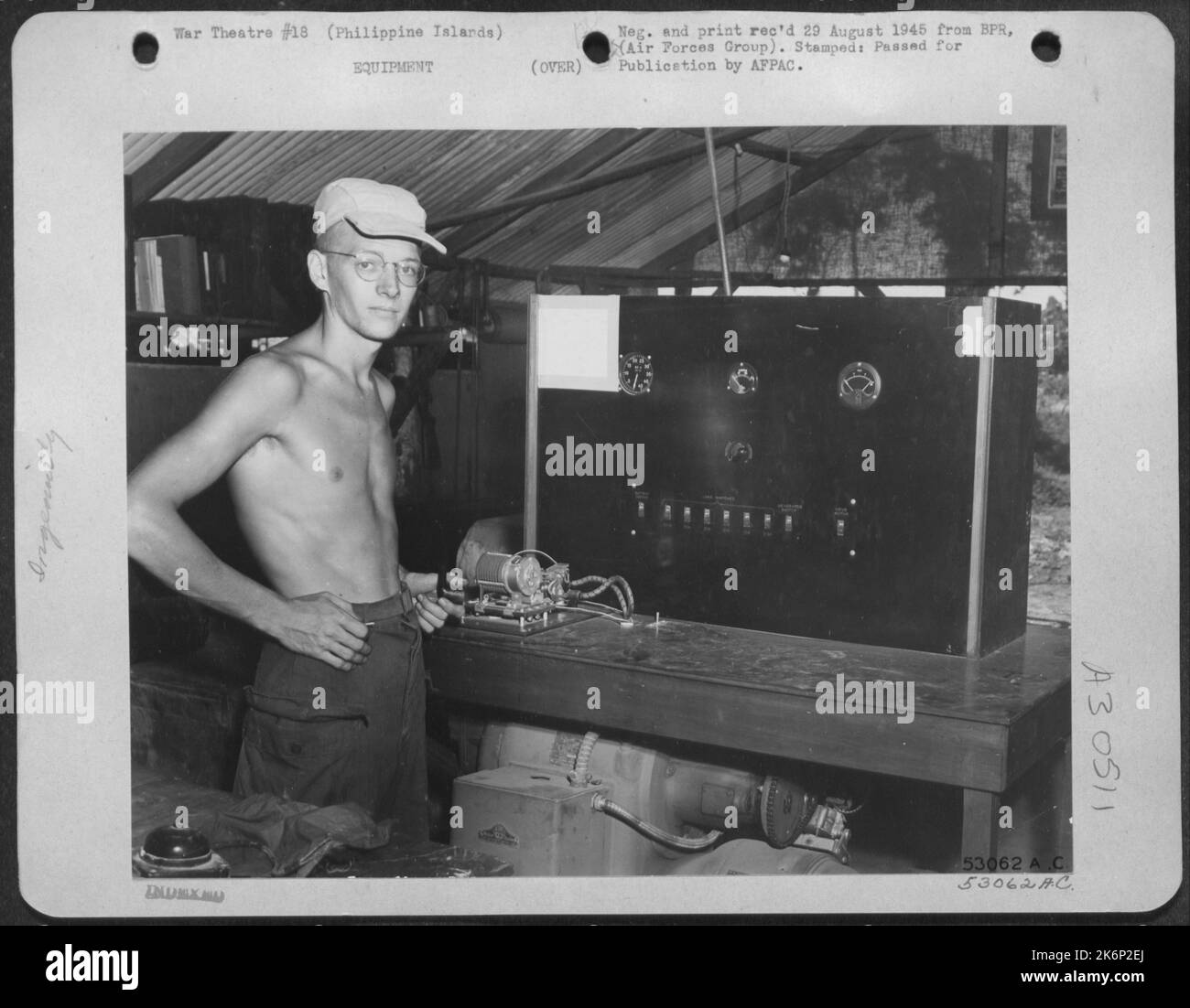 T/Sgt. George W. Clark stands beside the modified testometer which is ...