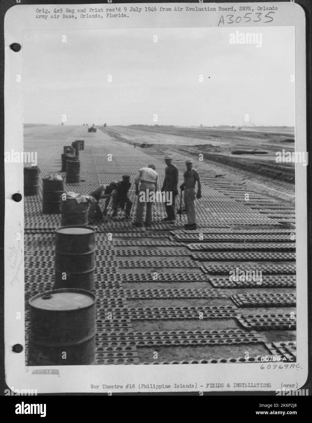 Engineers of the 1913th Aviation Engineer Battalion laying steel ...