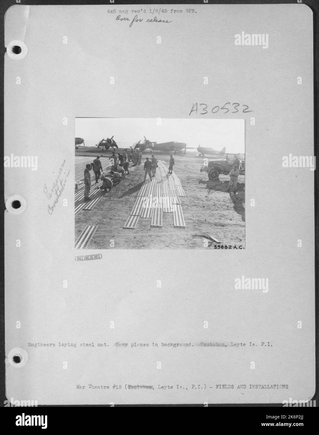 Engineers laying steel mat. Navy planes in background. Tacloban, Leyte ...