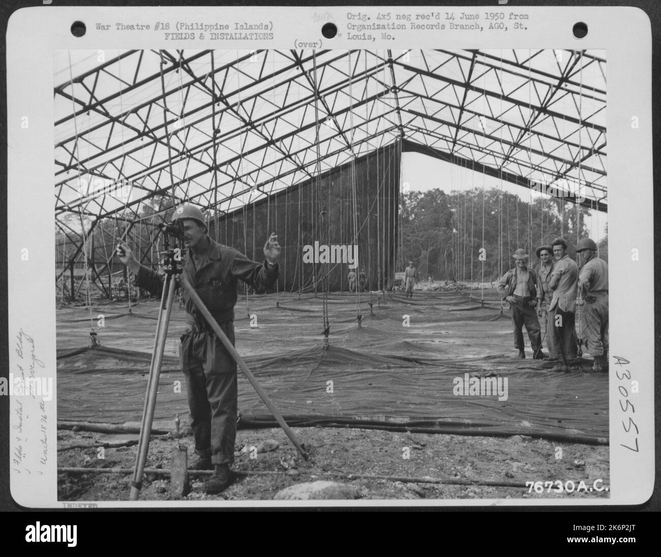 Surveyor of the 1876th Engineer Aviation Battalion at work during the ...