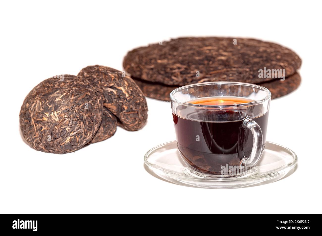 Pu Er tea in glass cup isolated on white background. Traditional black chinese rough tea Pu Erh ...