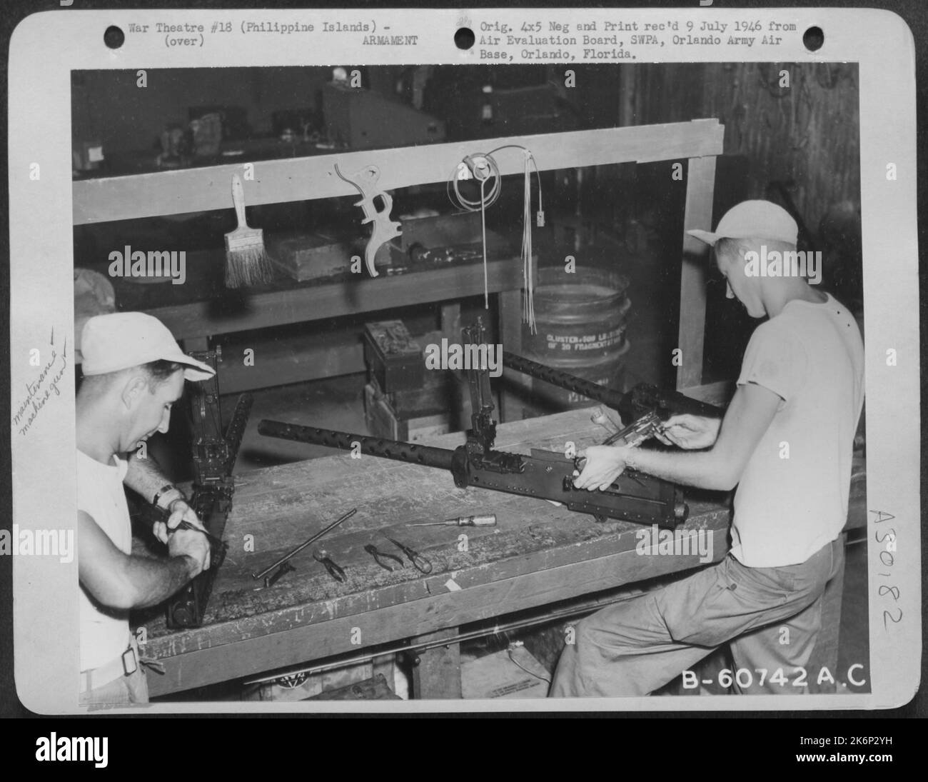 Armament Men Repairing 50 Cal. Machine Guns At Clark Field, Philippine ...