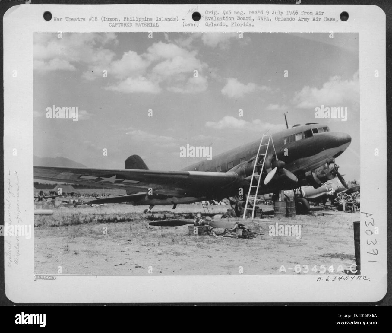 Japanese "Tabby" captured by our forces, shown at Clark Field being put ...