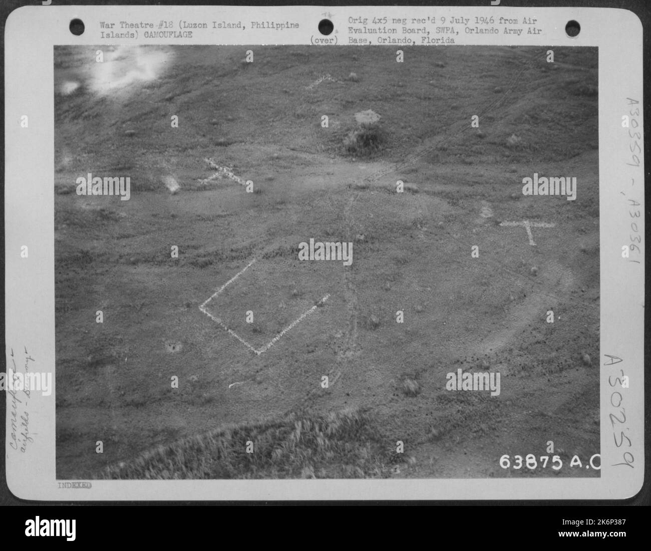 An aerial view of a Jap dummy airfield in the Clark Field area. Three ...