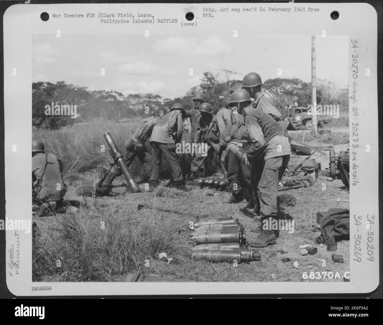 The 4.2 mortars throw their lethal barrage at the Japs up in the hills ...