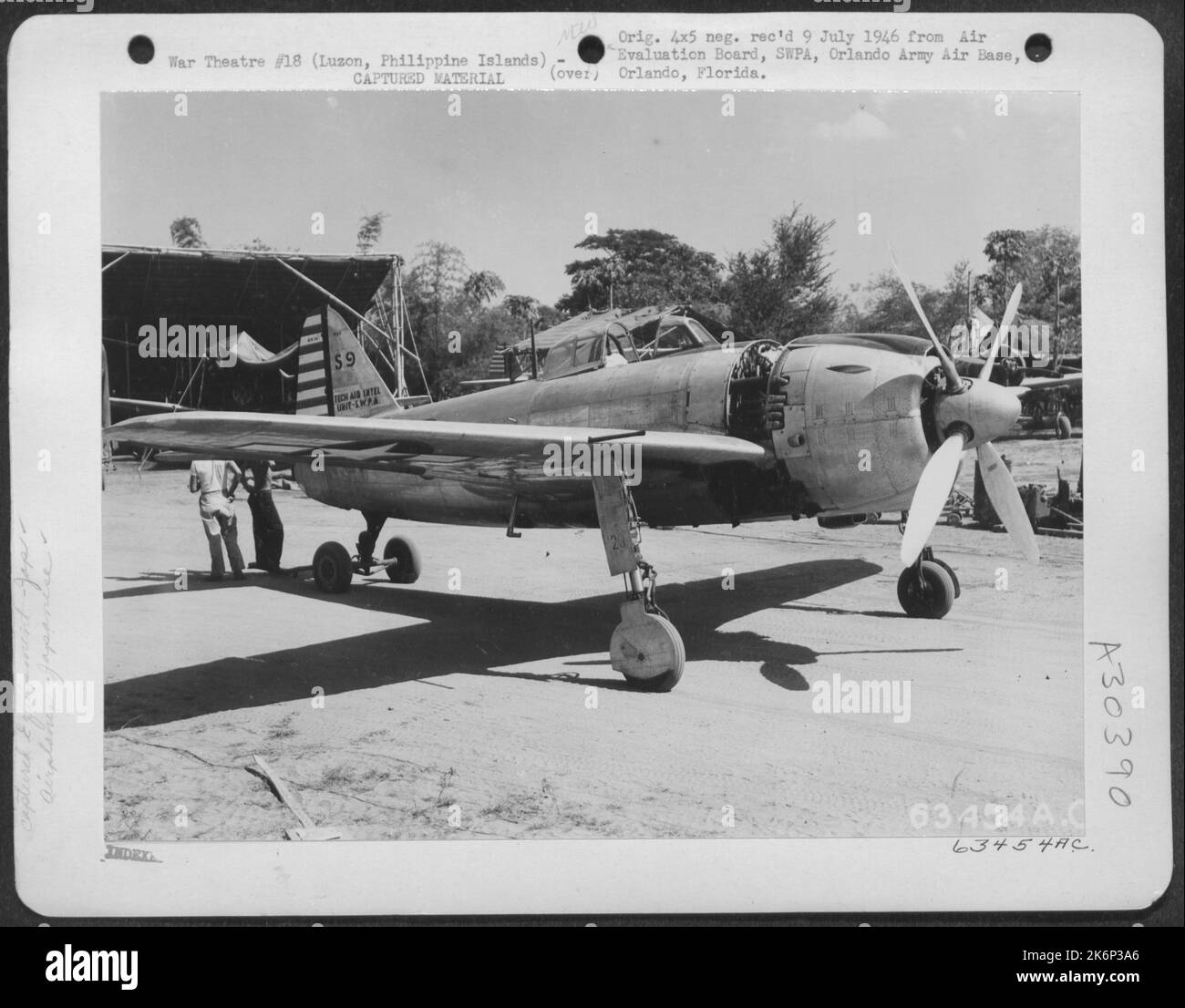 Japanese "George"captured by our forces, shown at Clark Field being put ...