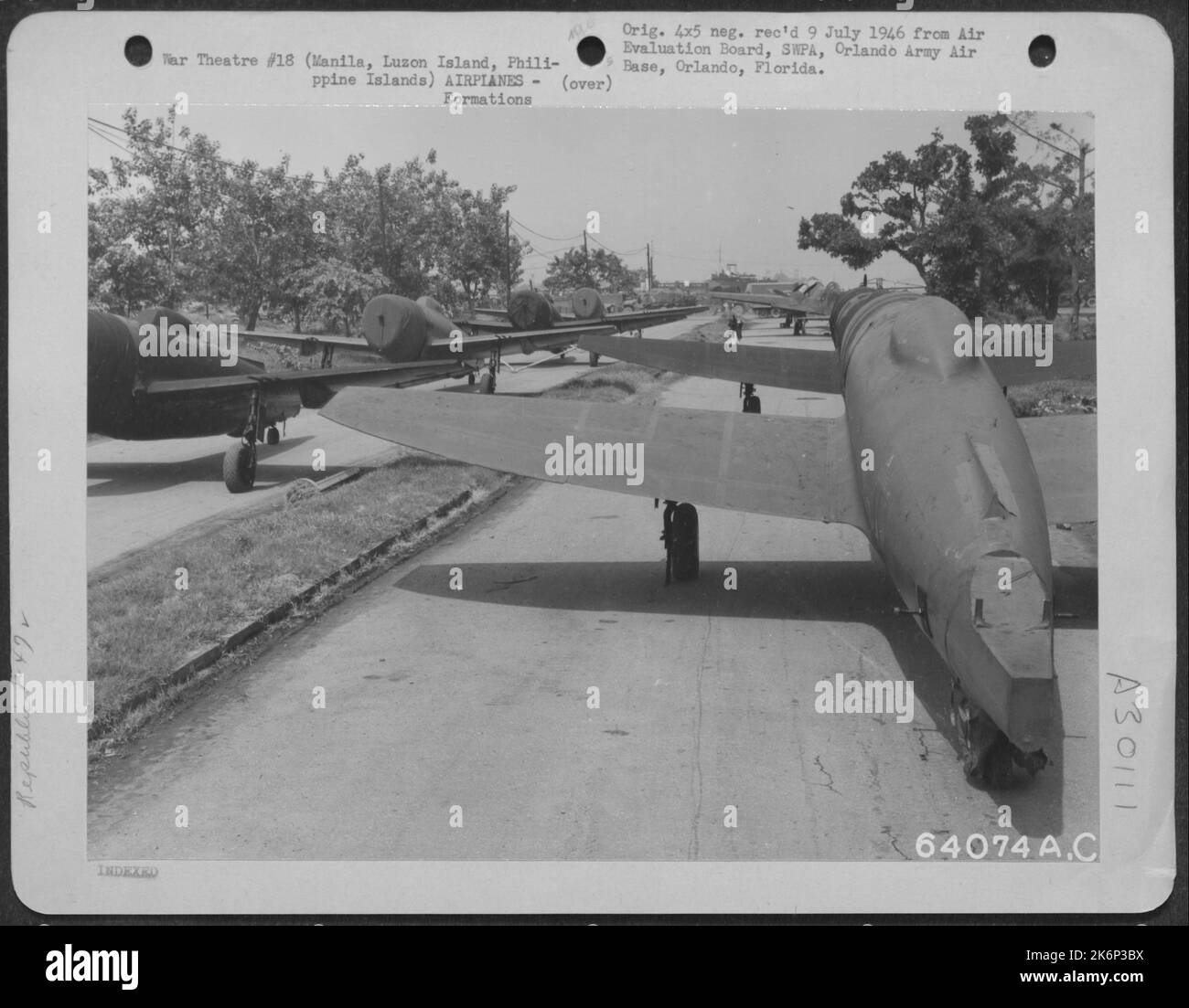 Republic P-47 "Thunderbolts" just unloaded from the ship await ...