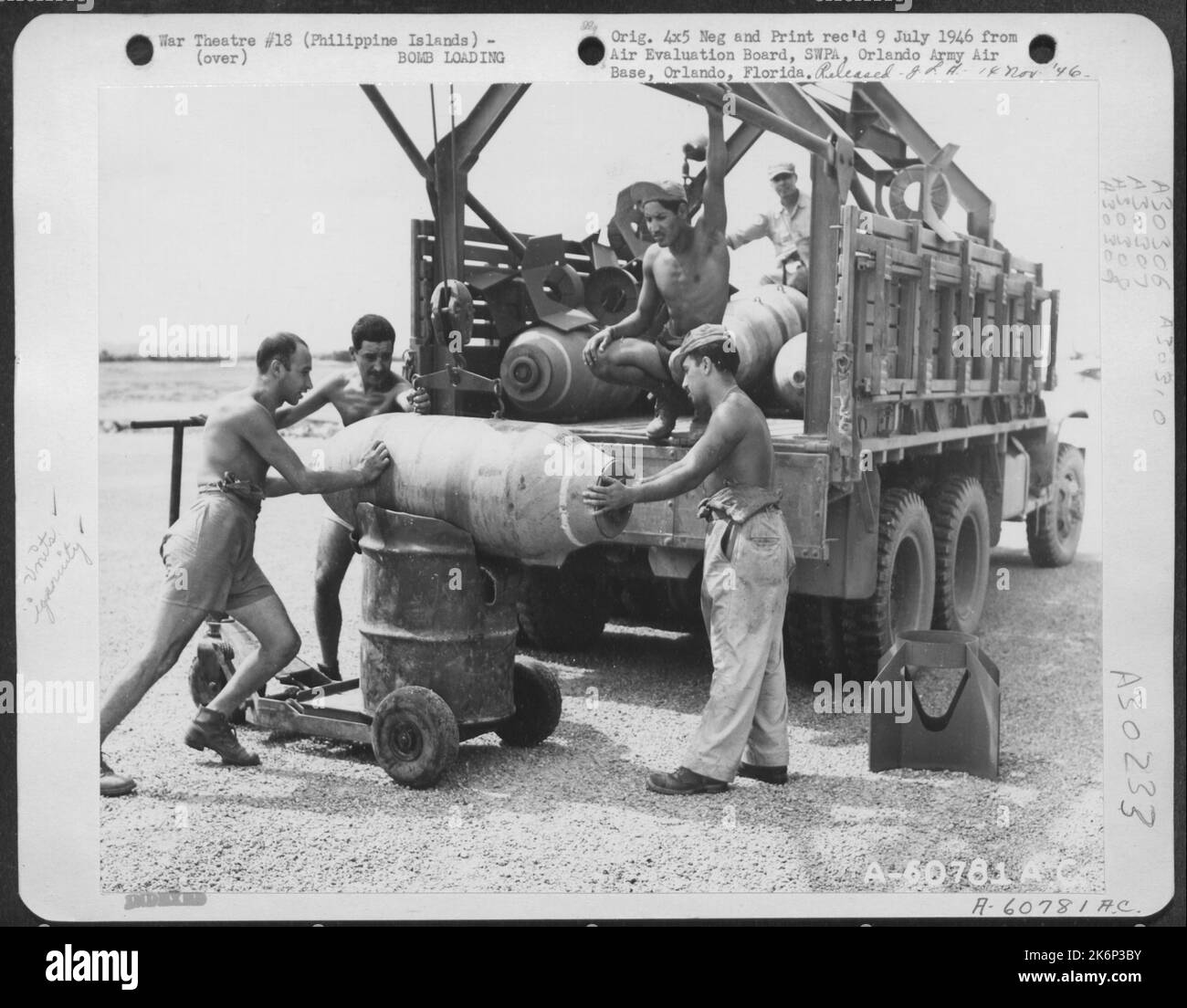 1000 lb bombs being unloaded on a special hand cart at Porac Airstrip ...