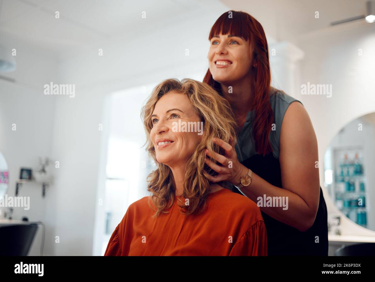 Hairdresser, senior woman client and hair care consultation with young ...