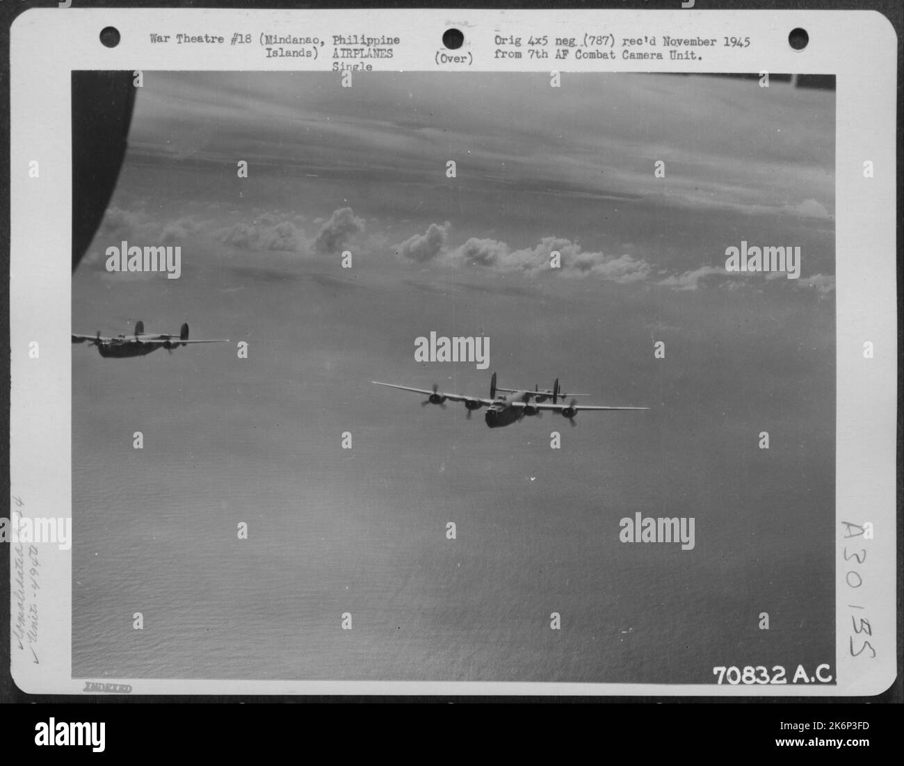 Consolidated B-24 "Liberators" of the 494th Bomb Group, fly high above ...