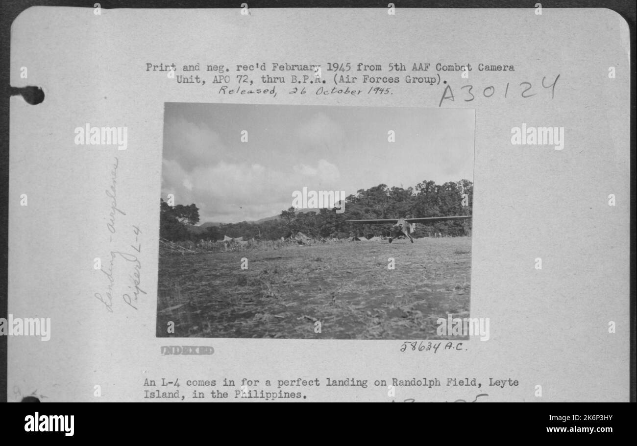 An L-4 comes in for a perfect landing on Randolph Field, Leyte Island ...