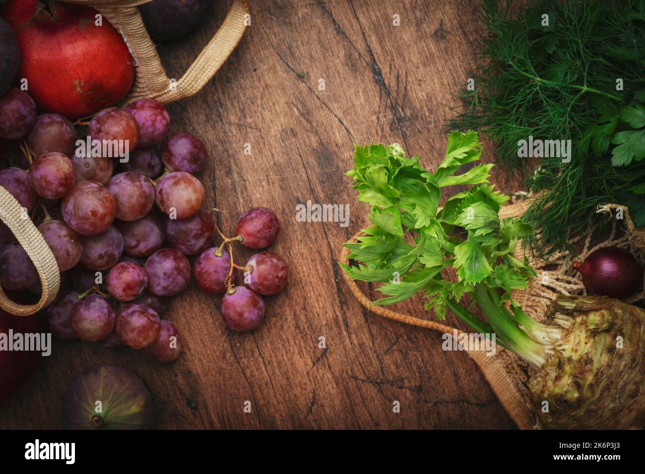 Autumn food background with vegetables, root crops and fruits in string ...