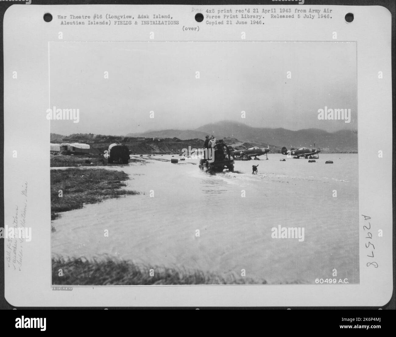Bell P-39s parked on the flooded runway at Longview, Adak Island in the ...