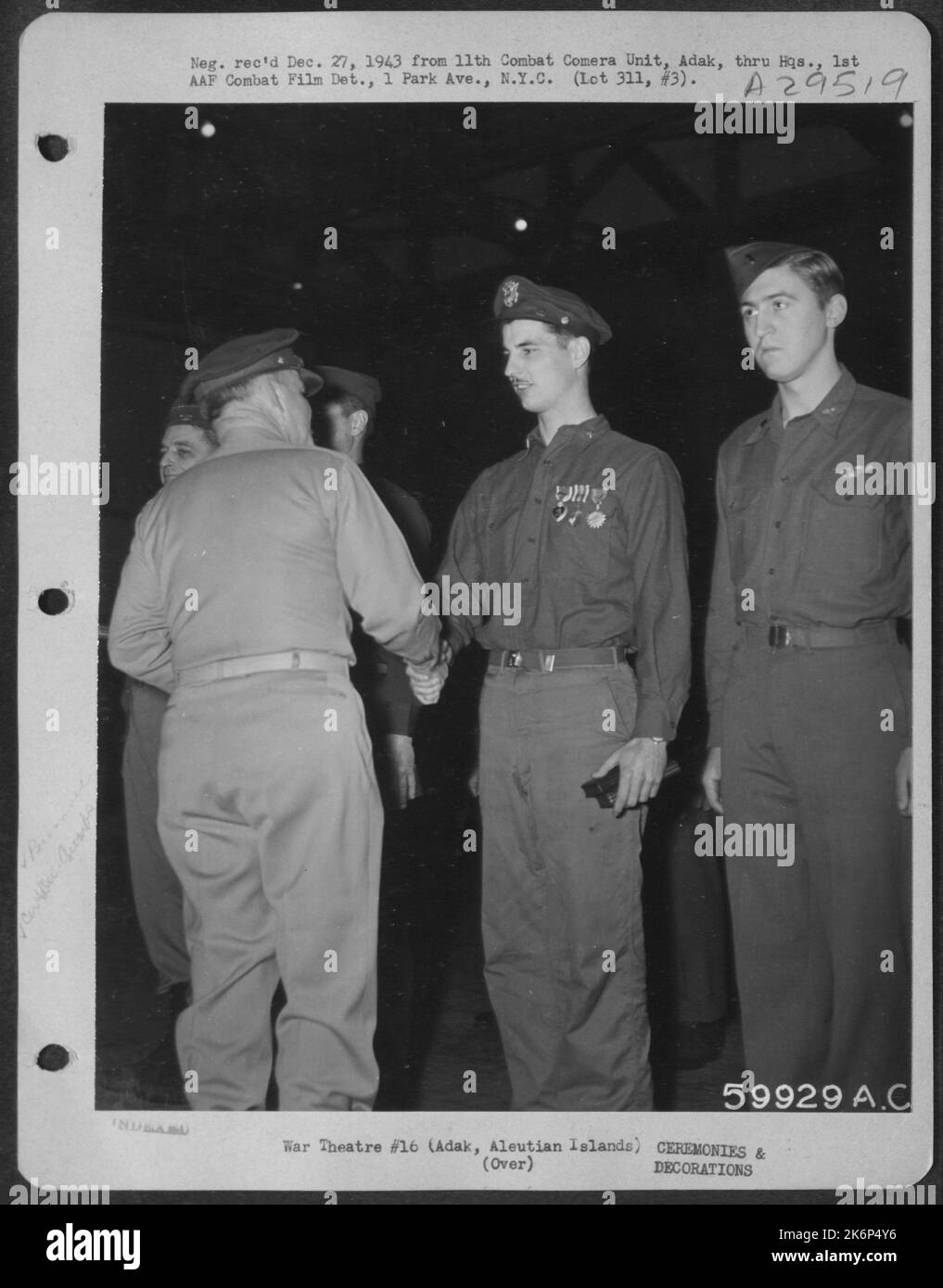 Maj. Gen. Davenport Johnson congratulating Capt. Jerome J. Jones on ...