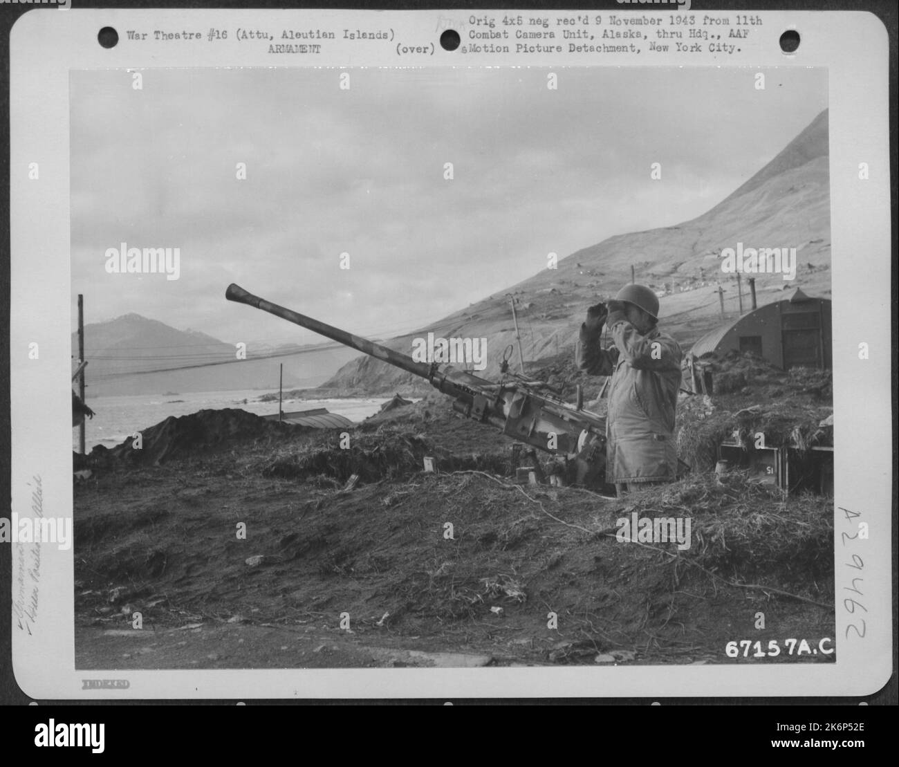 An alerted gunner in a 40 mm gun position on Alexai Point Airbase scans ...